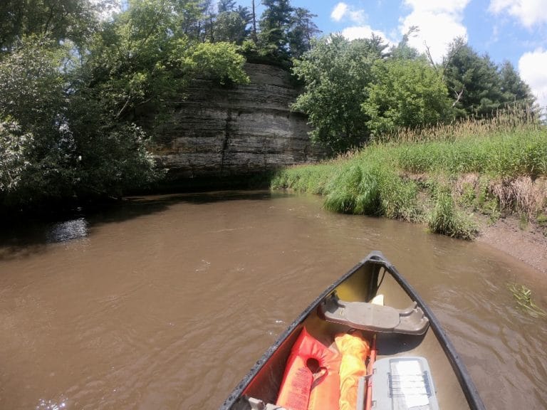 Driftless Region Pine River Wisconsin canoe poling through beautiful bluffs